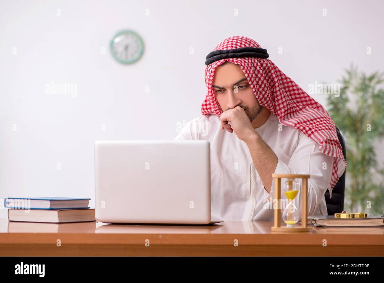 Male arab employee working in the office Stock Photo - Alamy