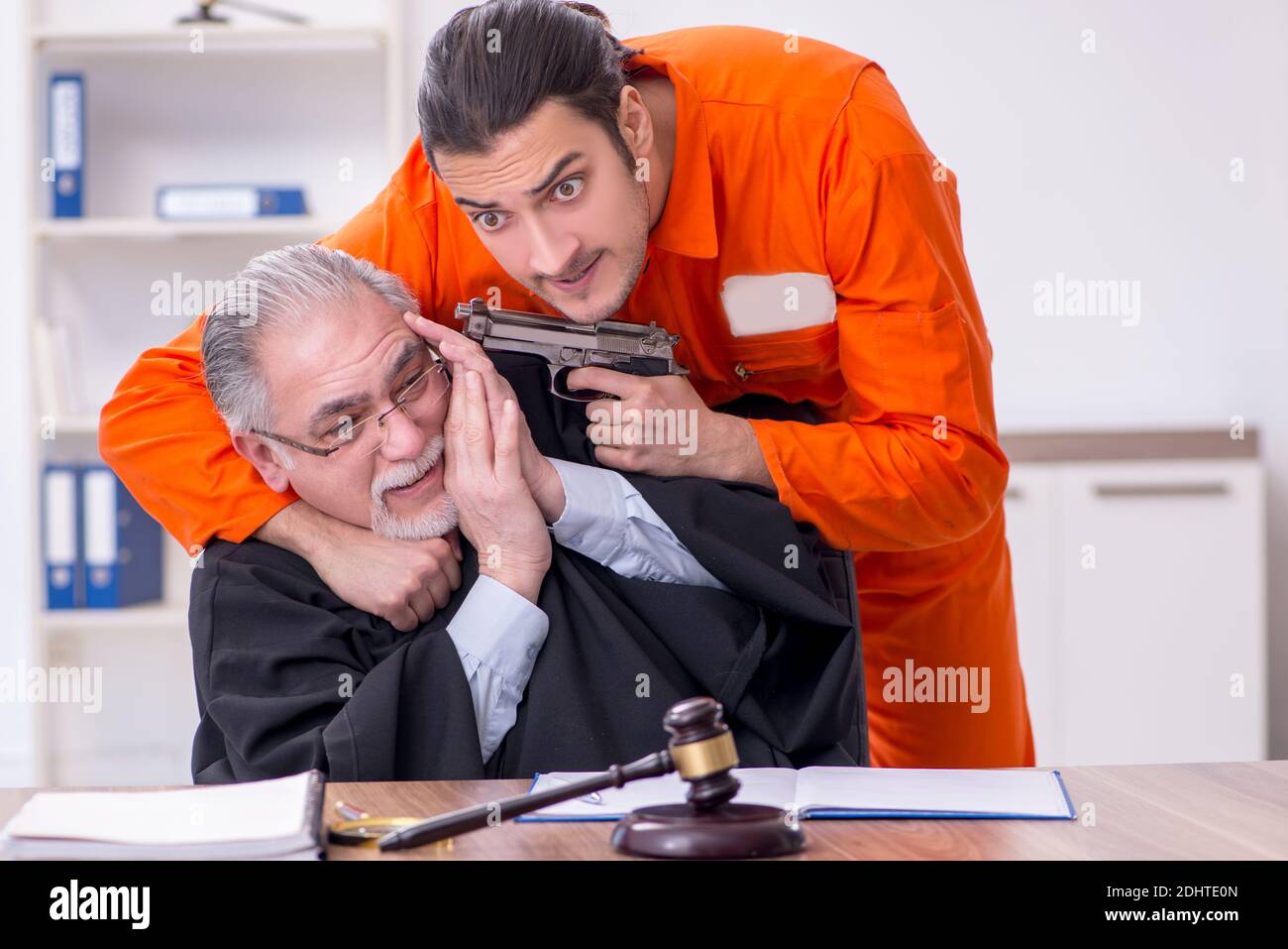 Old judge meeting with young captive in courthouse Stock Photo - Alamy