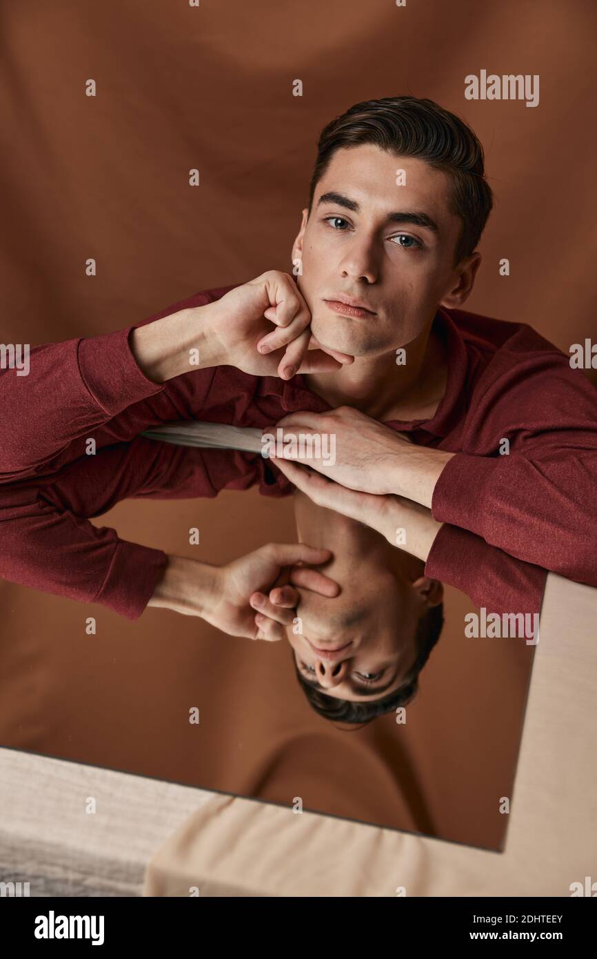 reflection of a man in the mirror and fabric background model brown ...