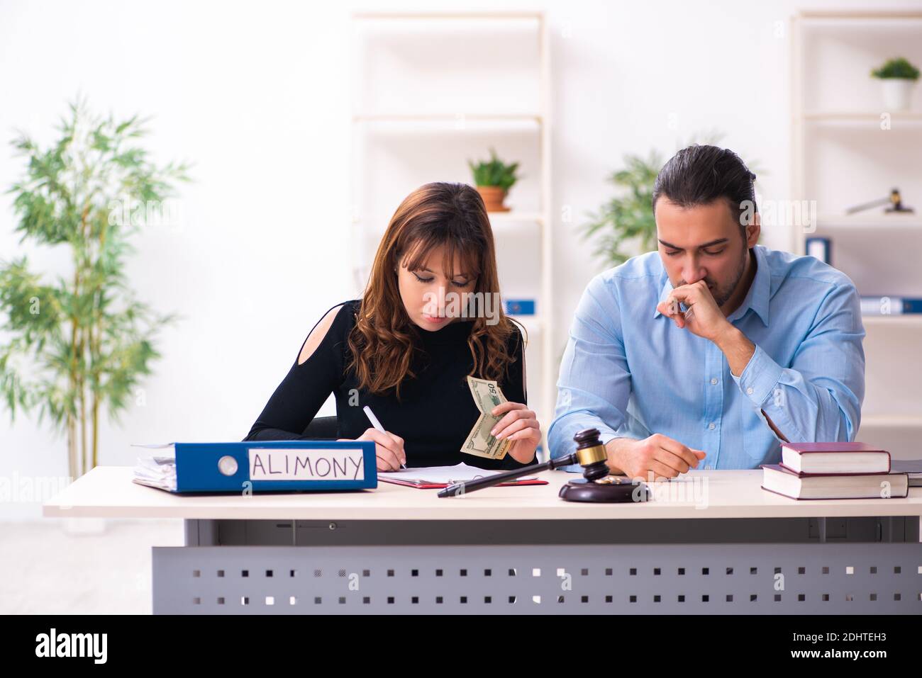 Couple divorcing in alimony concept Stock Photo - Alamy