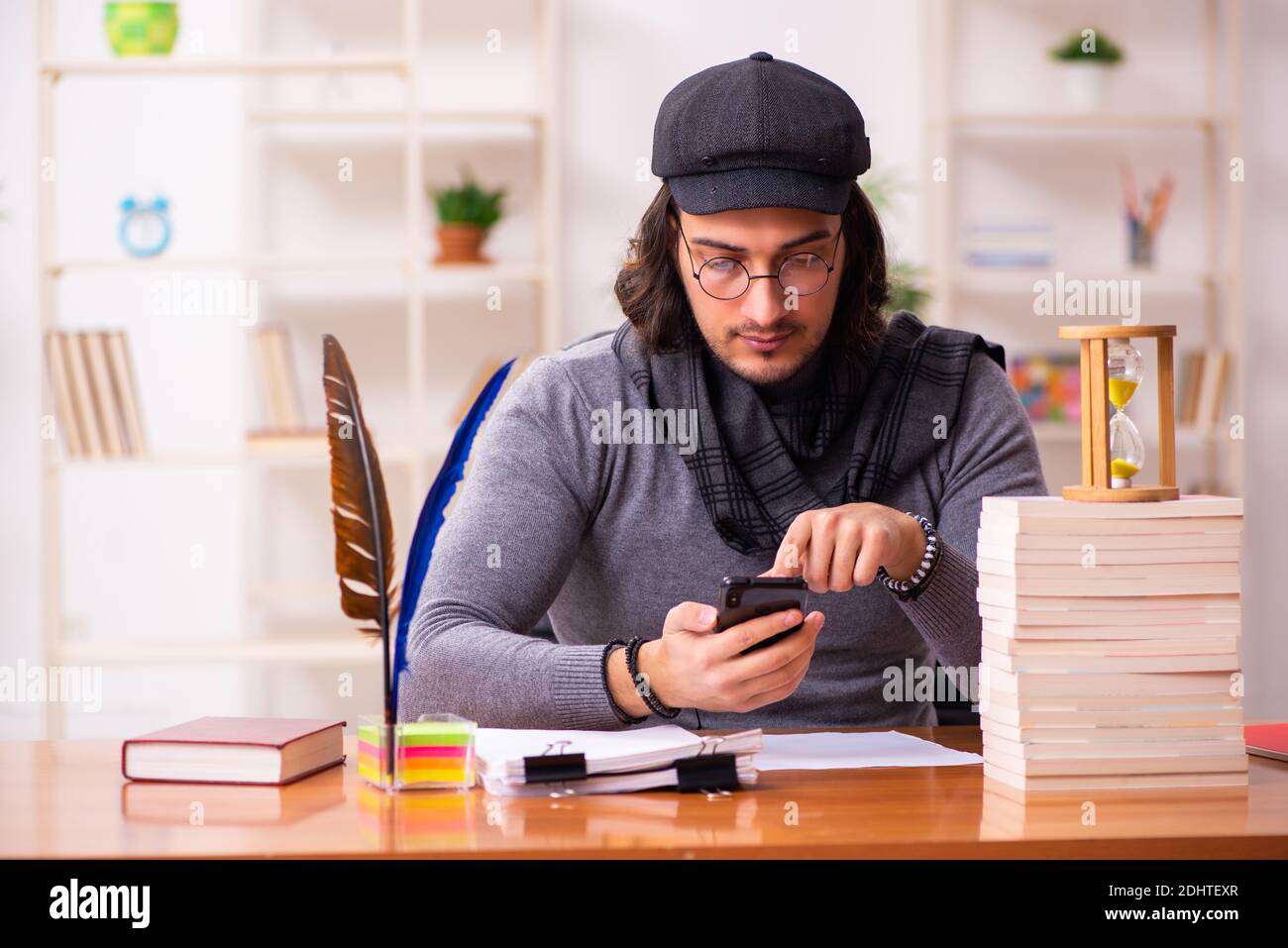 Male writer in time management concept Stock Photo - Alamy