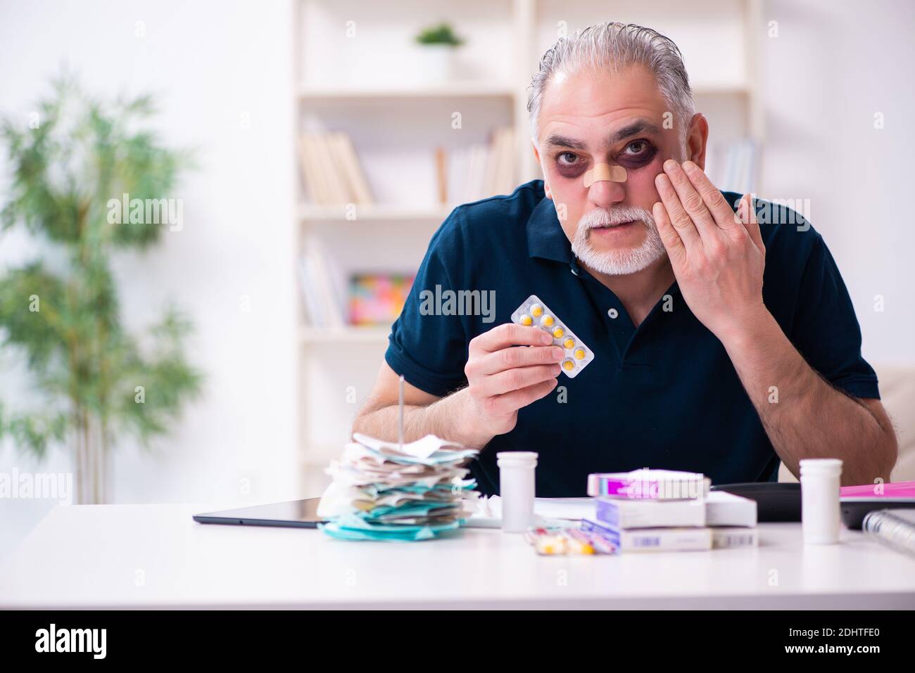 Old man in budget planning concept Stock Photo - Alamy