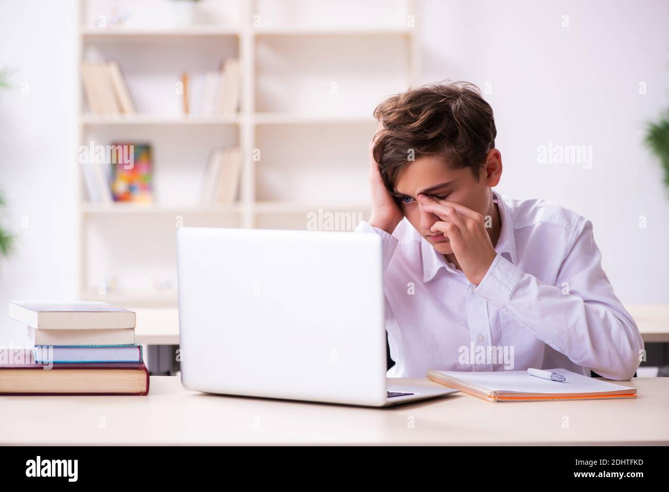 Schoolboy in teleeducation concept in the classroom Stock Photo - Alamy