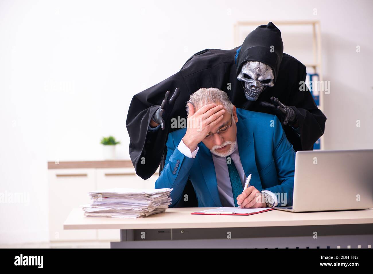Old businessman employee making deal with the devil Stock Photo - Alamy