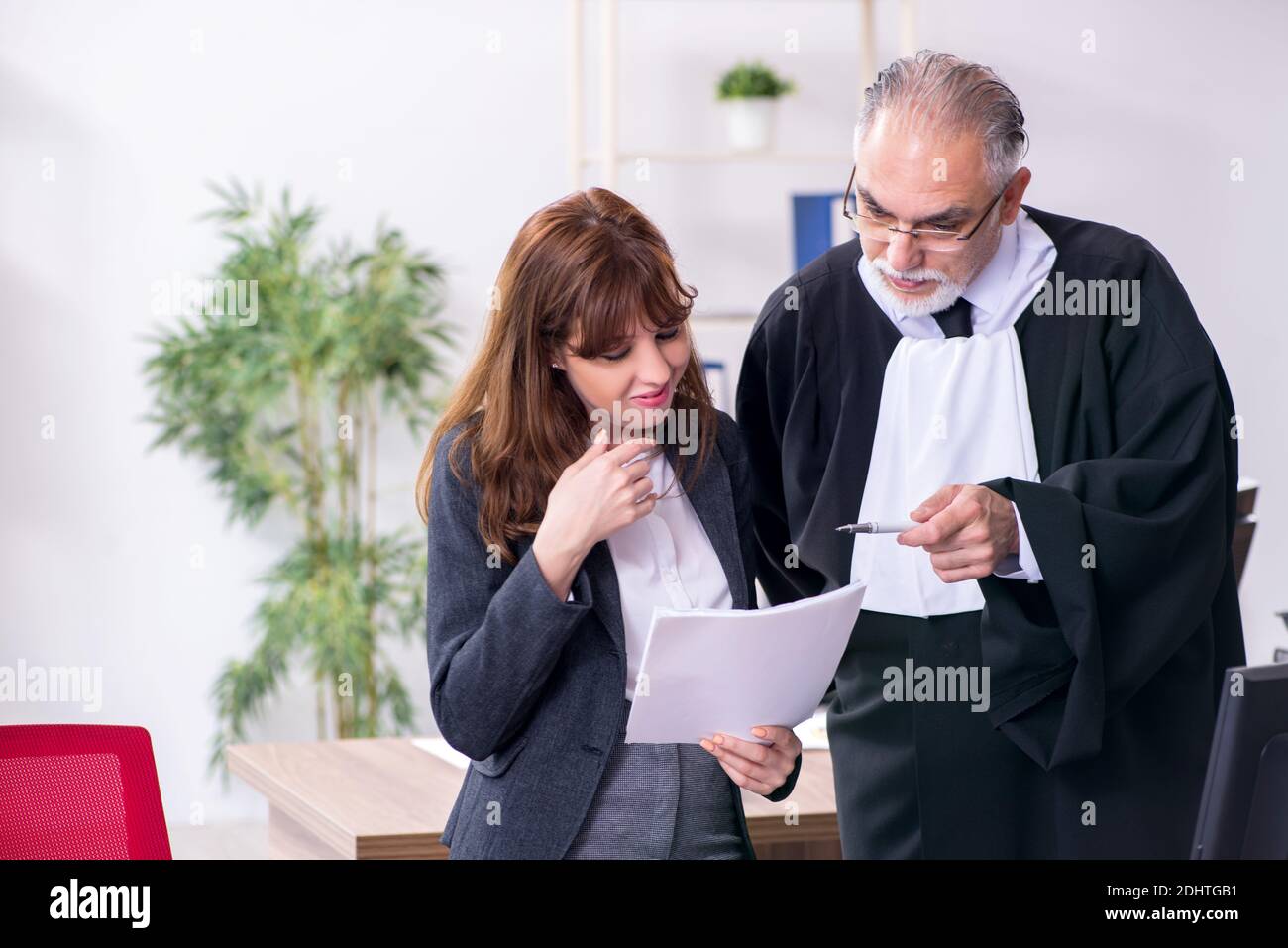 Old judge and his young secretary in the office Stock Photo - Alamy