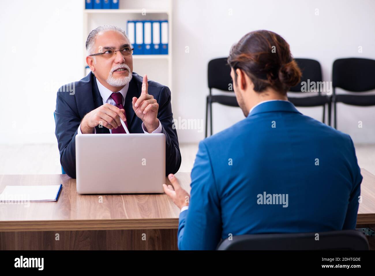 Male candidate employee meeting with old recruiter Stock Photo - Alamy