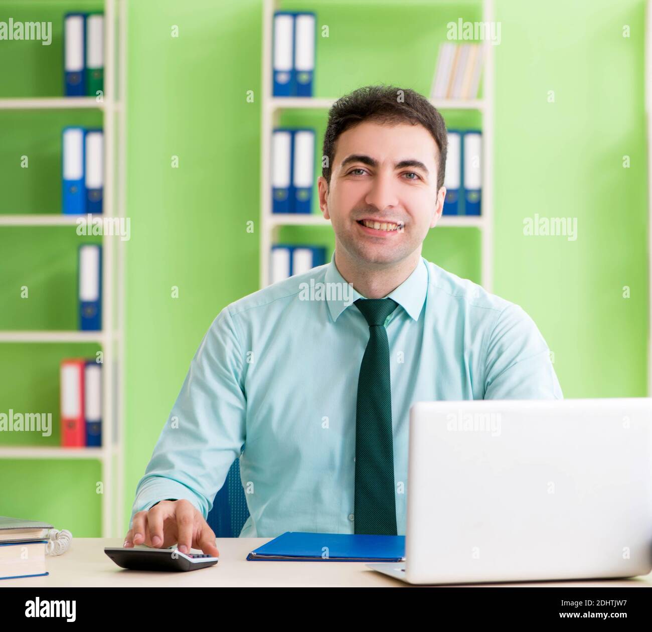The male financial manager working in the office Stock Photo - Alamy