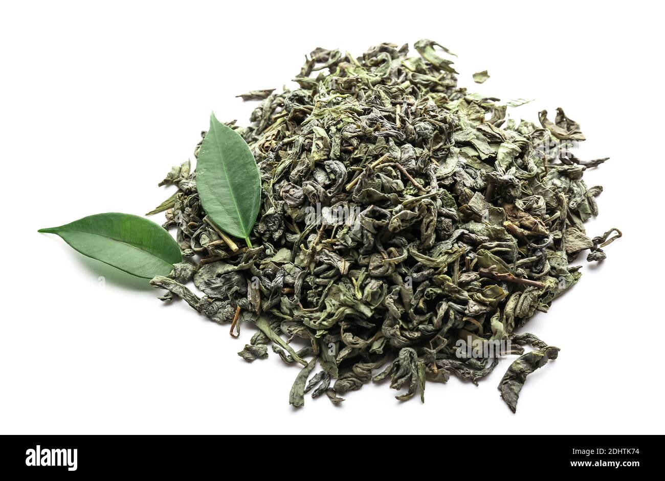 Dry tea leaves on white background Stock Photo - Alamy