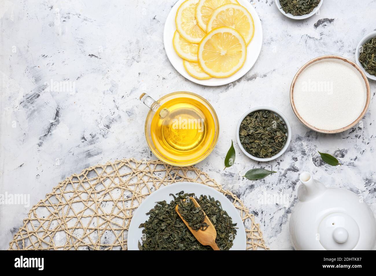 Cup of hot aromatic tea with dry tea leaves on table Stock Photo - Alamy