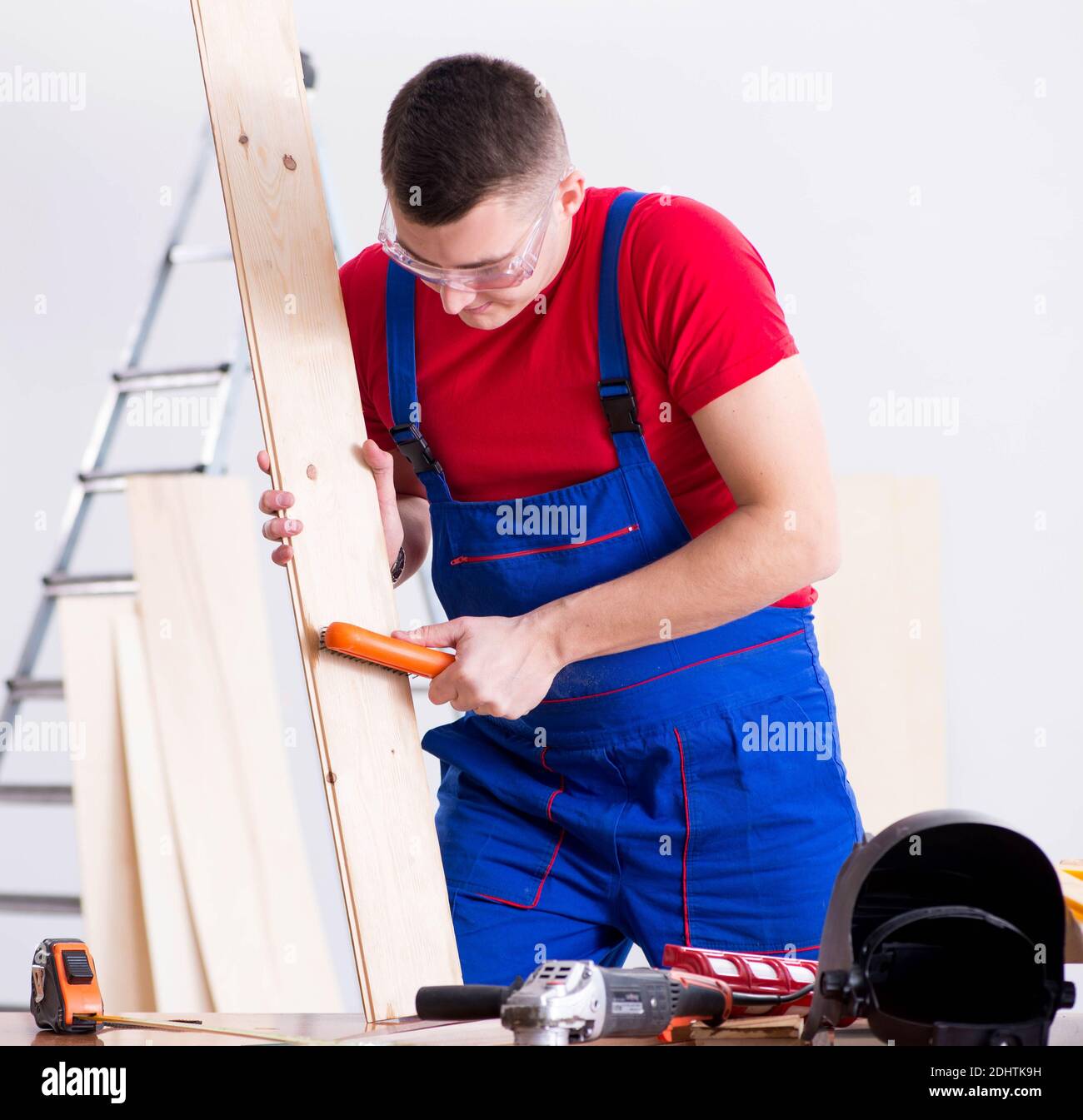 The contractor working in the workshop Stock Photo - Alamy