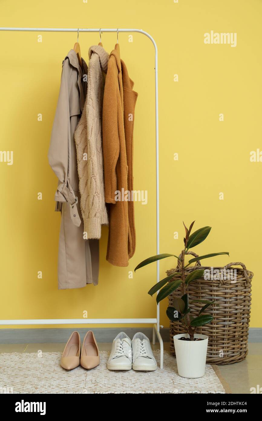 Stylish interior of modern hallway with rack Stock Photo - Alamy