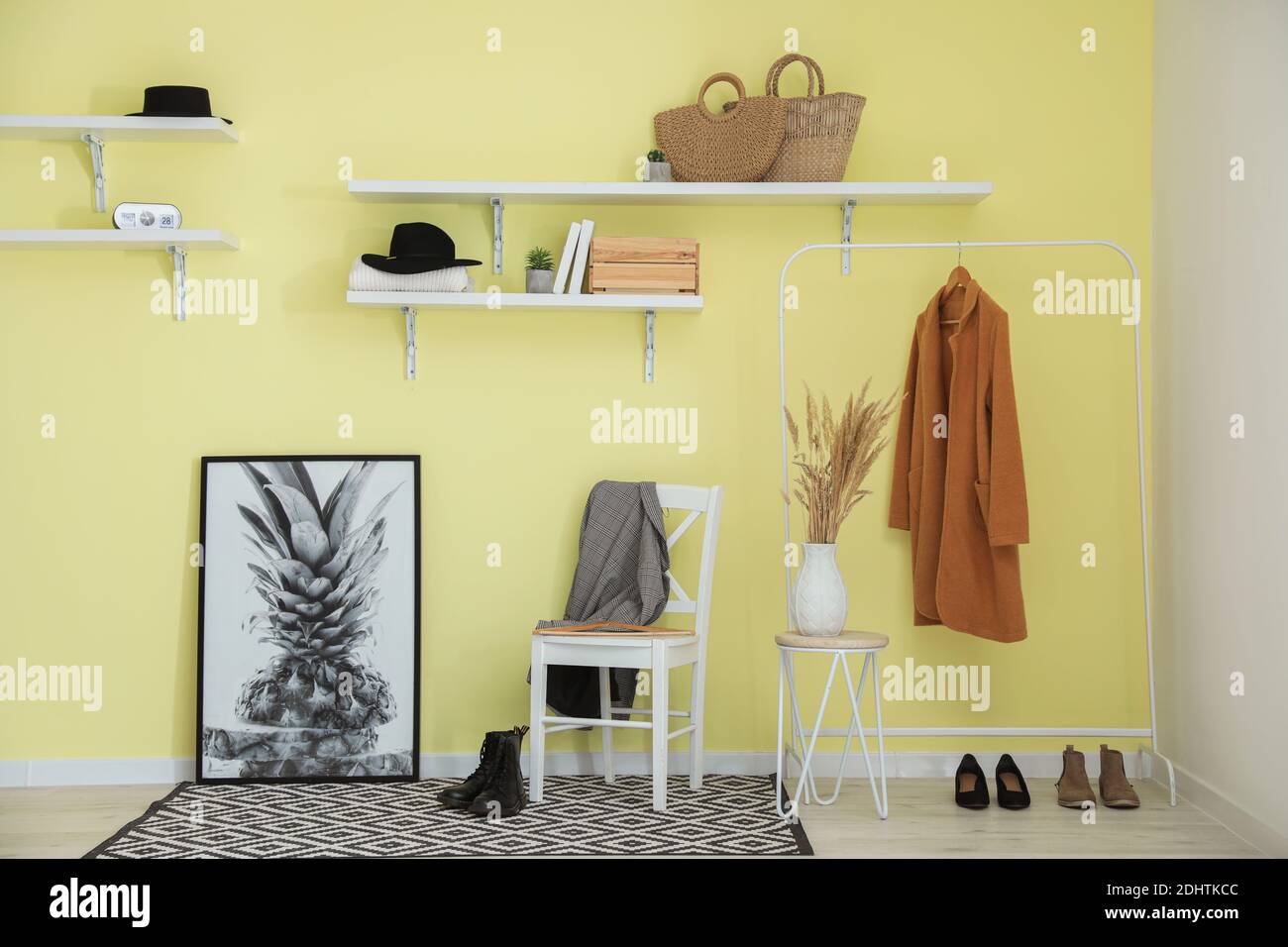 Stylish interior of modern hallway with rack Stock Photo - Alamy