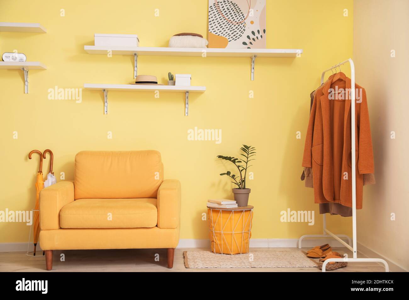 Stylish interior of modern hallway with rack Stock Photo - Alamy