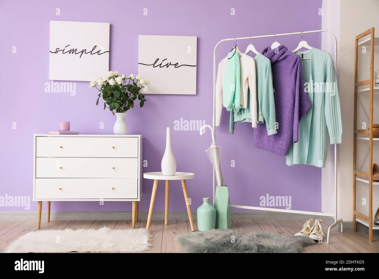 Stylish interior of modern hallway with rack Stock Photo - Alamy