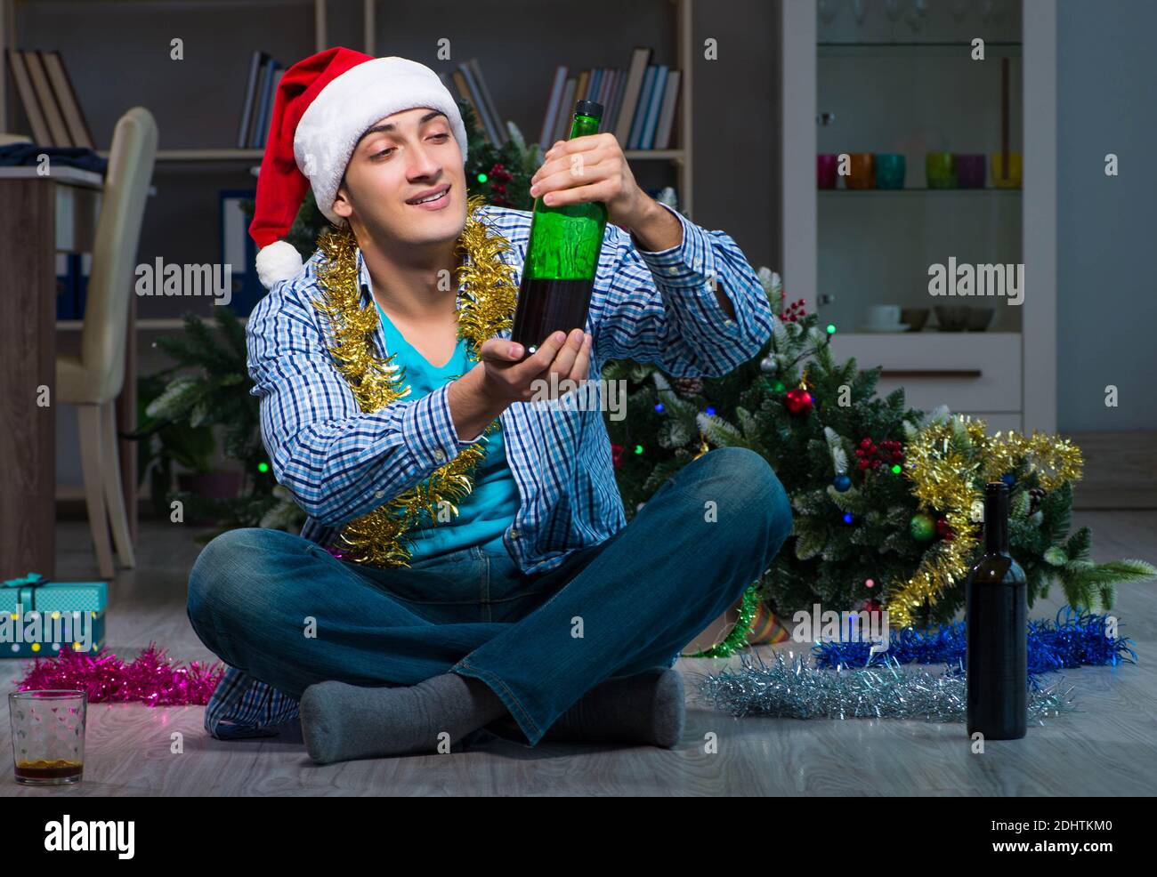 The man celebrating christmas at home alone Stock Photo - Alamy