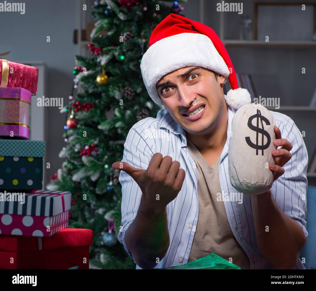 The man with many christmas gifts in boxes Stock Photo - Alamy