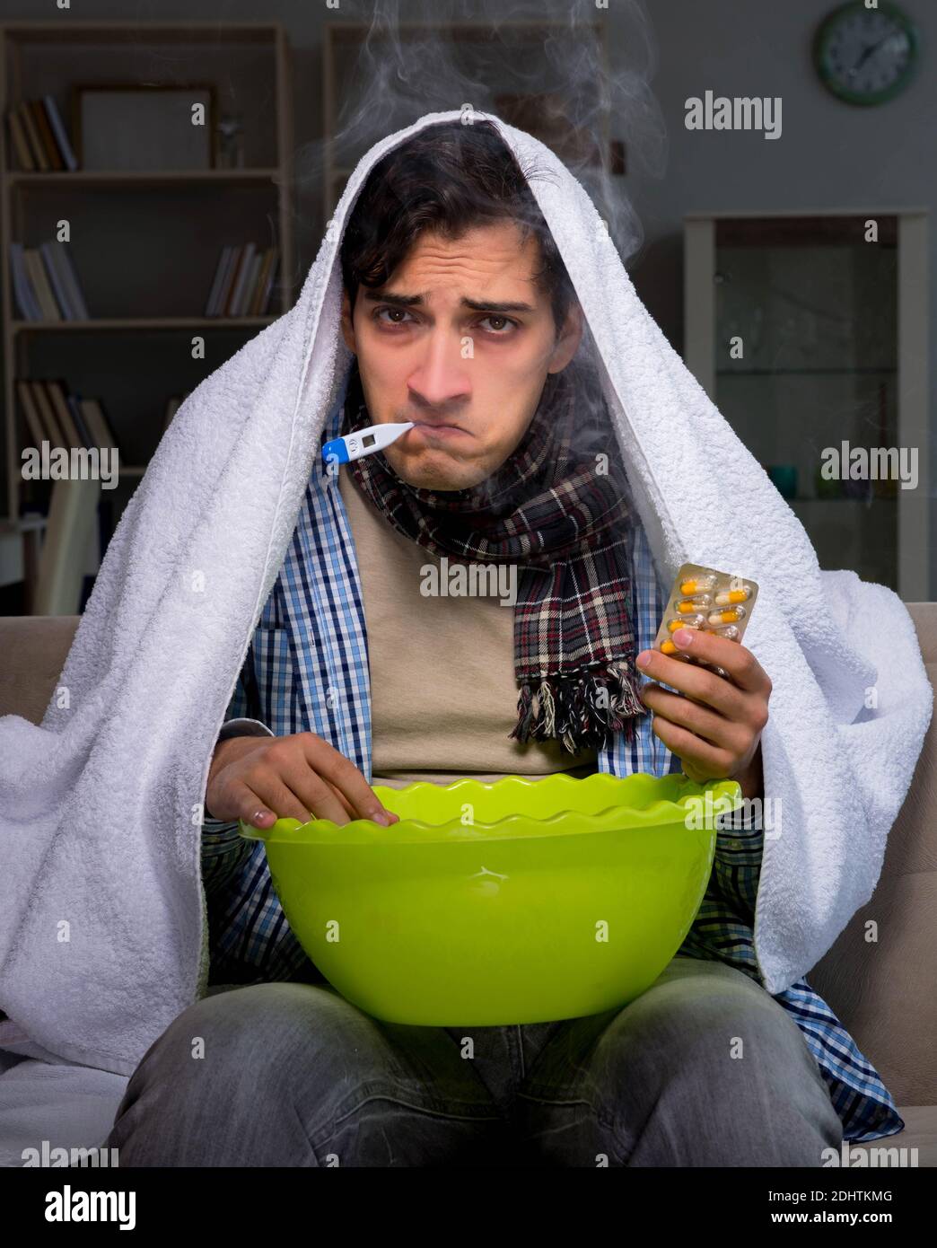 Sick man doing inhalation at night in home hi-res stock photography and ...