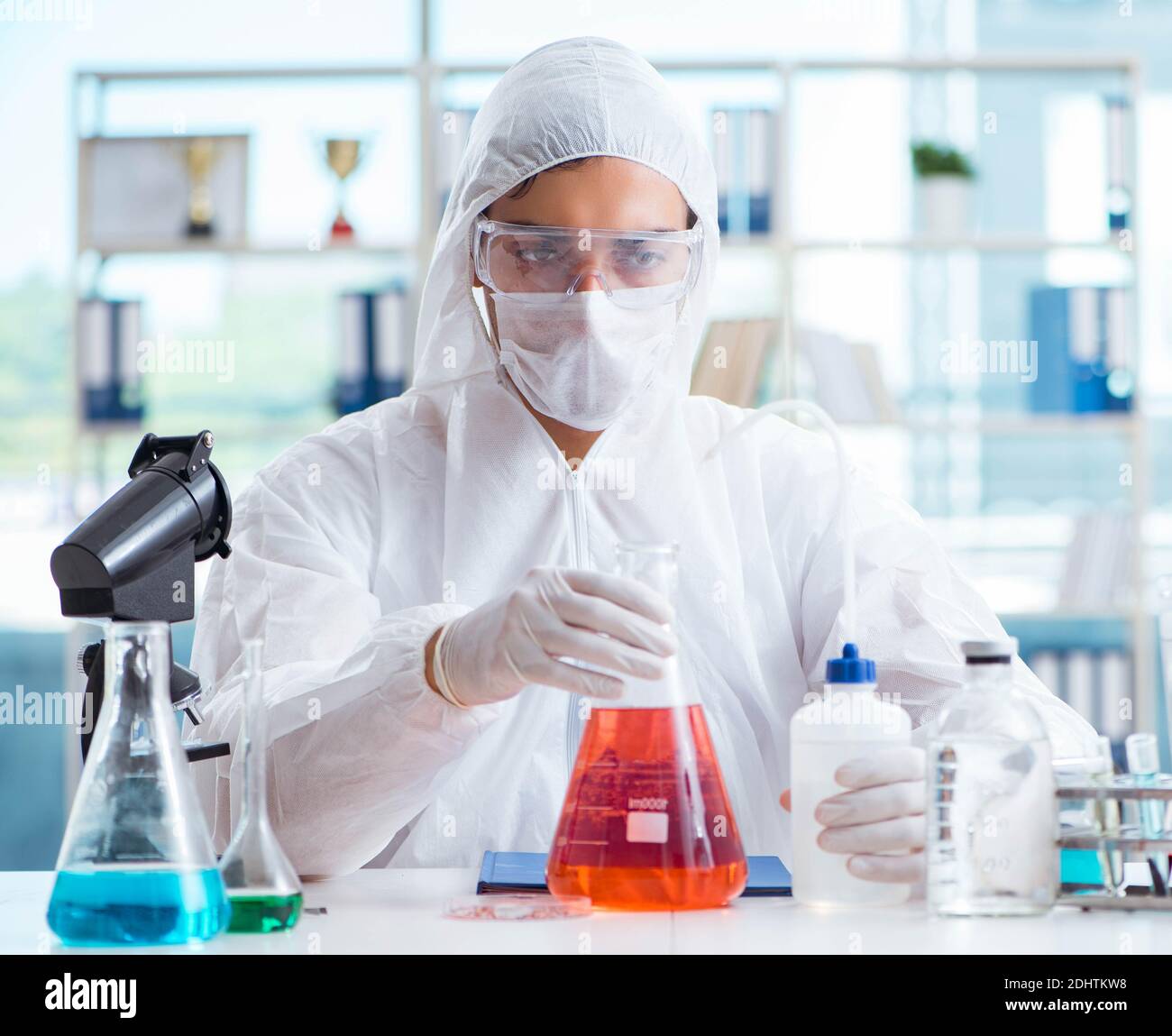 The chemist working in the laboratory with hazardous chemicals Stock ...