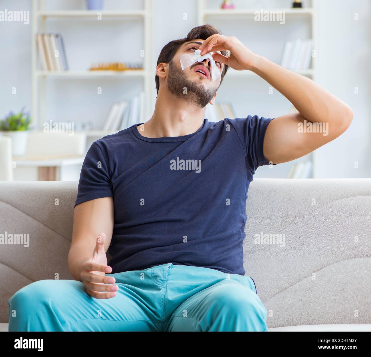 Young man recovering healing at home after plastic surgery nose job ...