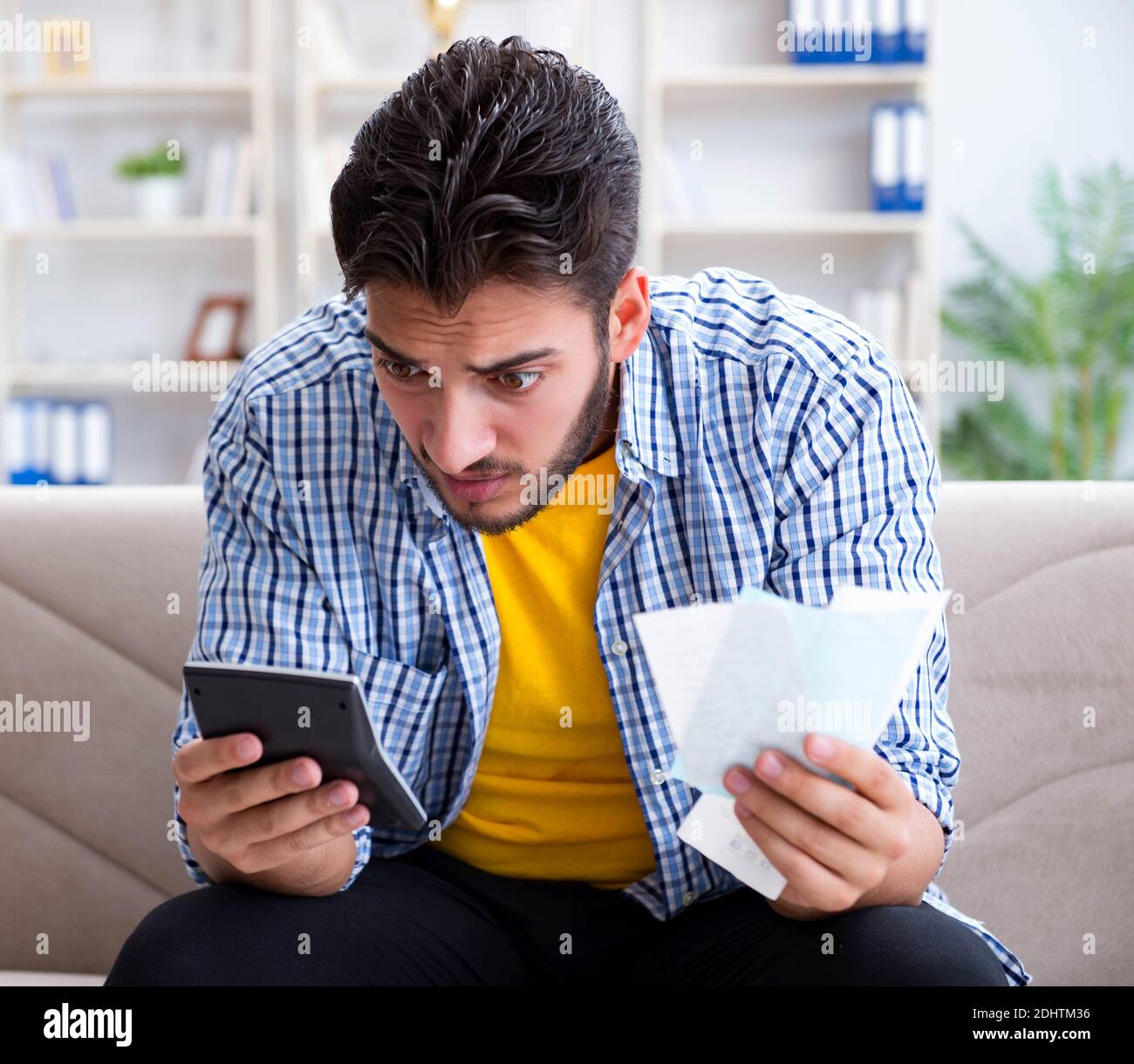 The man angry at bills he needs to pay Stock Photo - Alamy