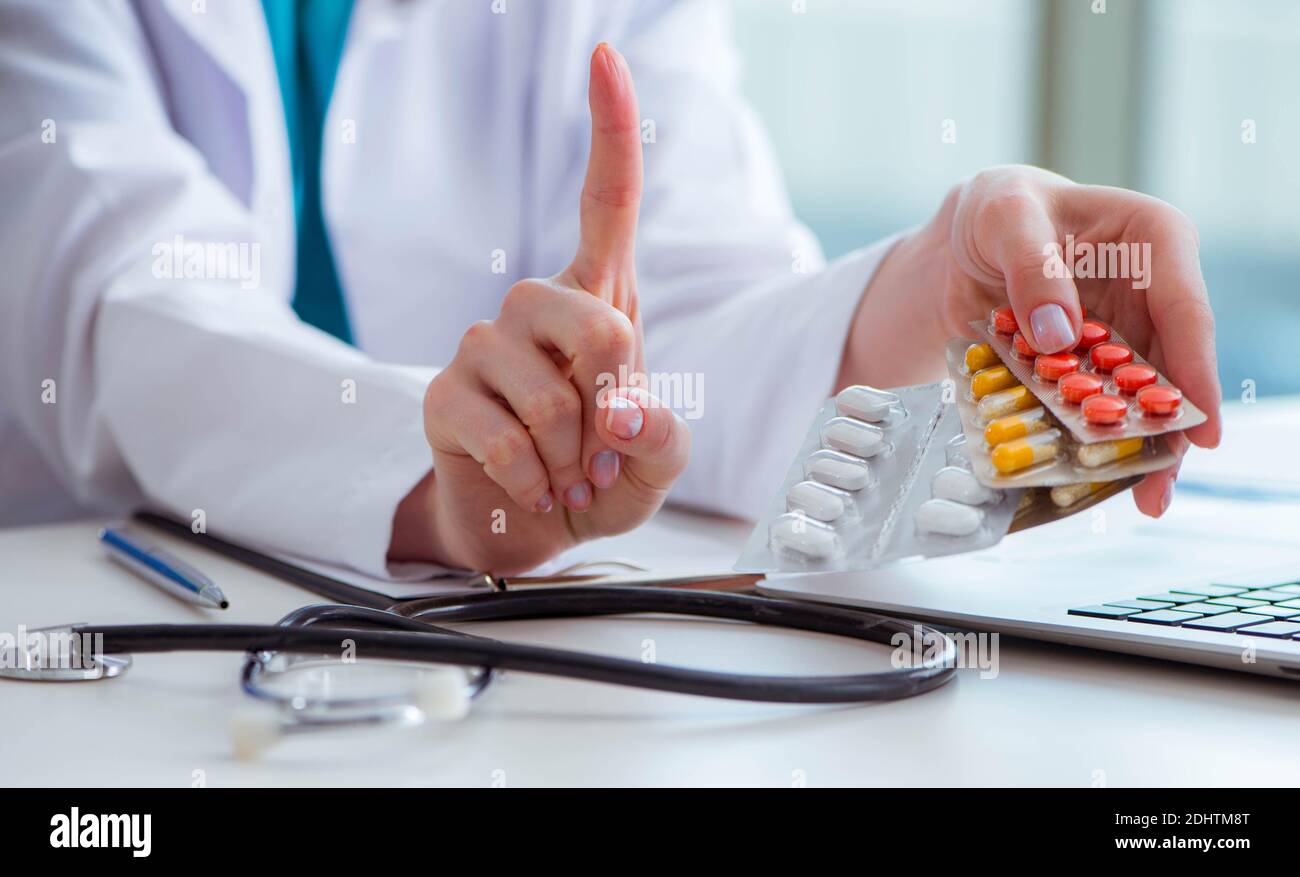 The doctor with prescribed medicines in medical concept Stock Photo - Alamy