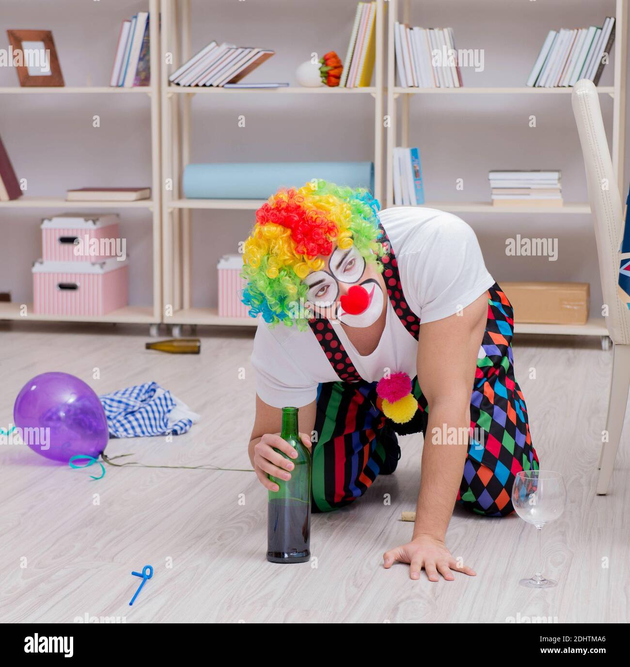 The drunk clown celebrating having a party at home Stock Photo - Alamy
