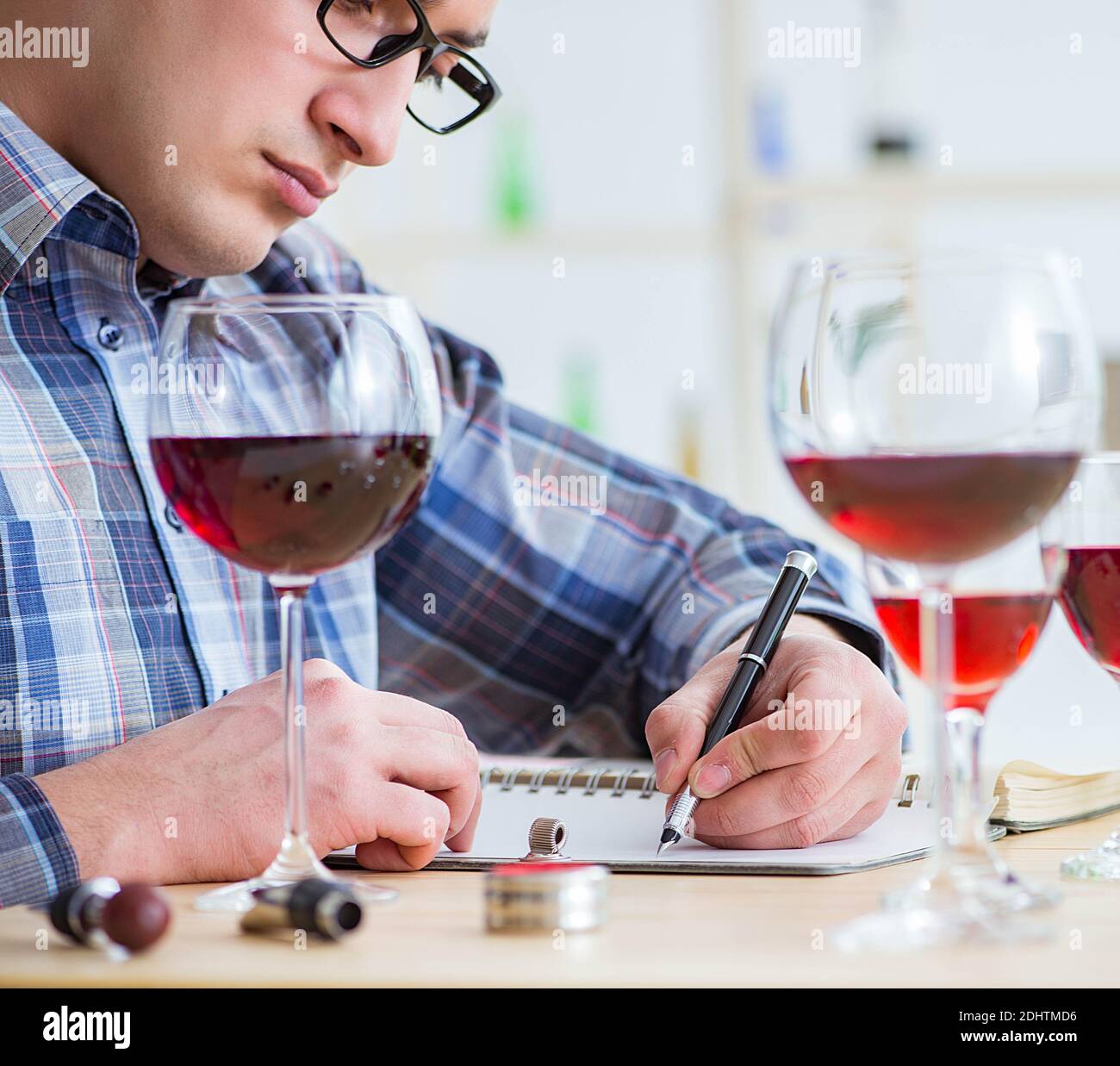 The professional sommelier tasting red wine Stock Photo - Alamy