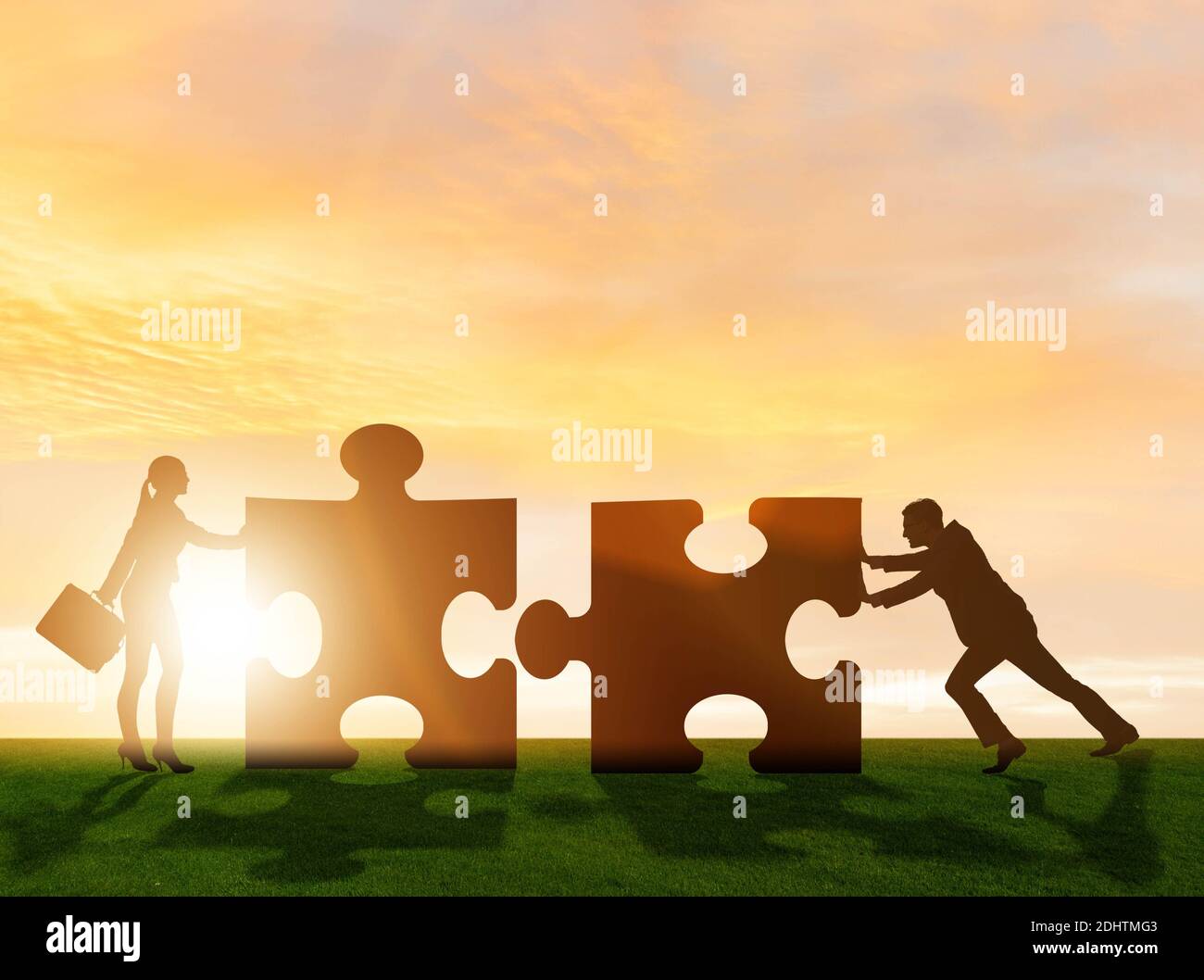 The business metaphor of teamwork with jigsaw puzzle Stock Photo - Alamy
