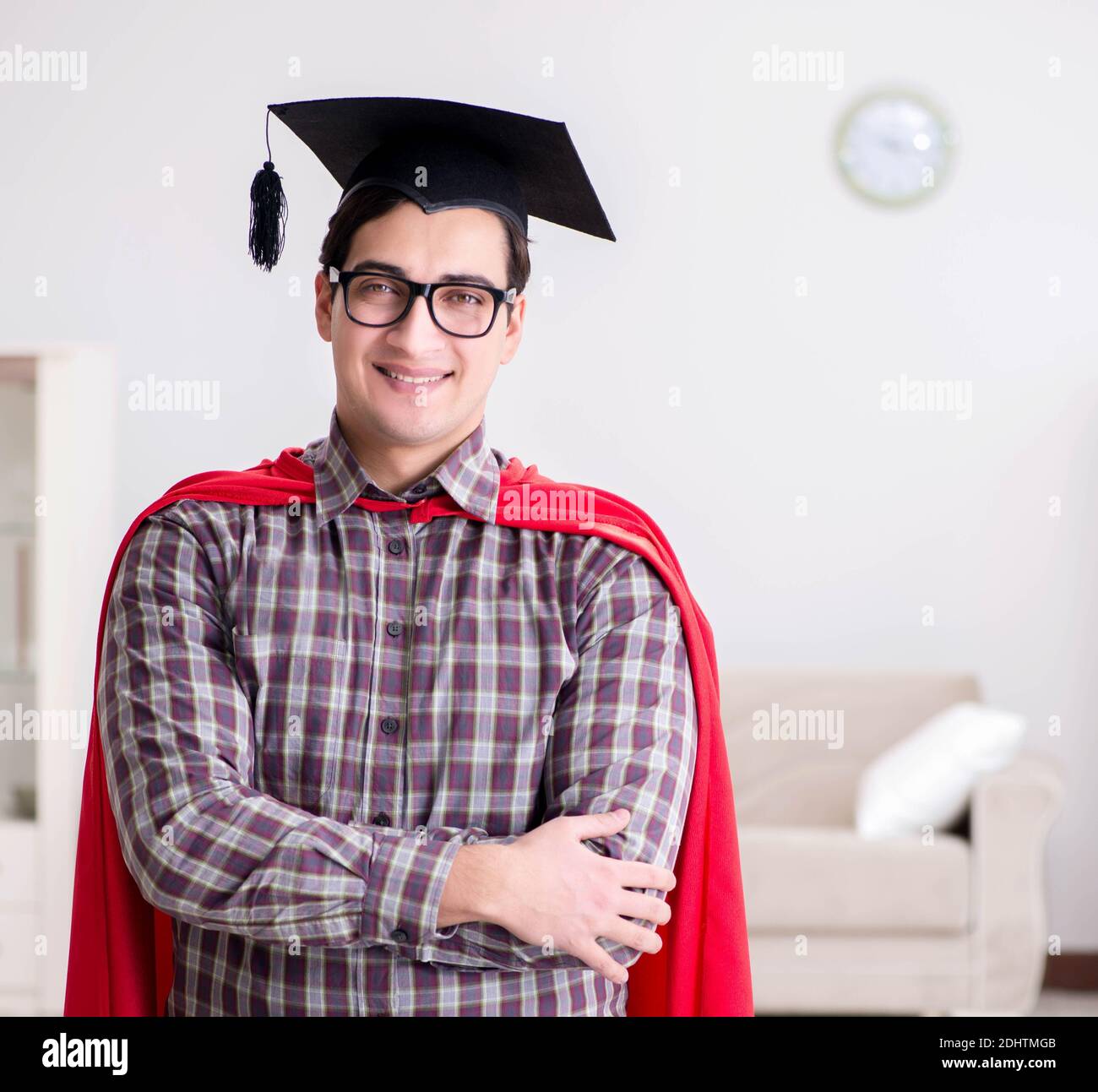 The super hero student wearing mortarboard in a red cloak Stock Photo ...