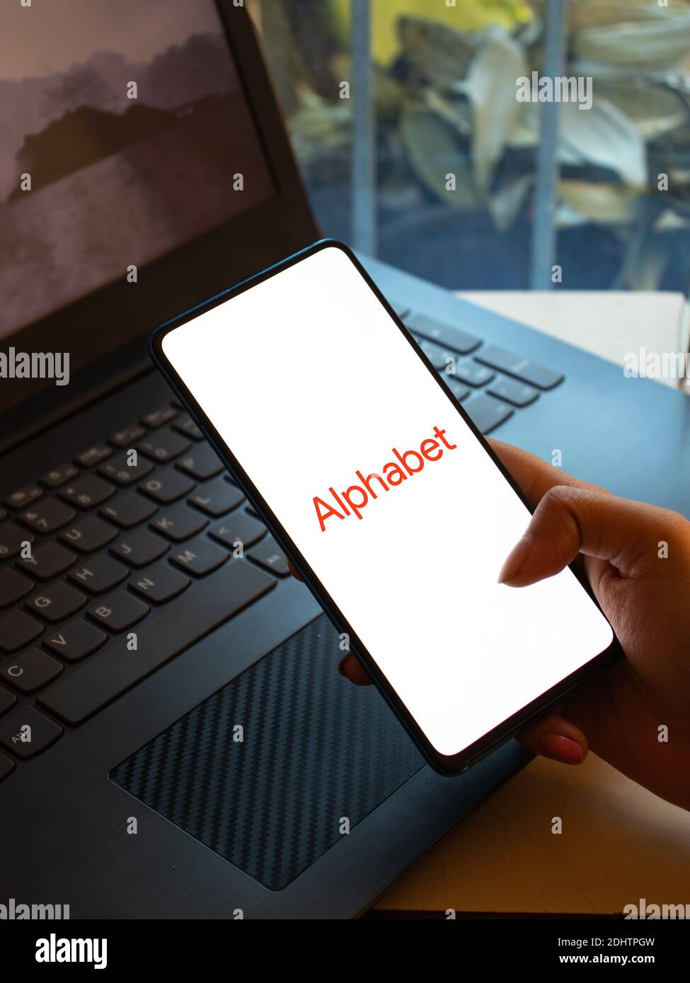 Assam, india - December 20, 2020 : Alphabet logo on phone screen stock ...