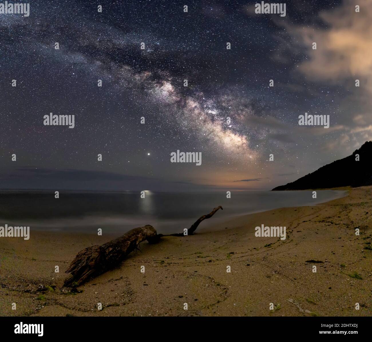 Milky way galaxy over black sea waste shore. Bilion stars in summer ...