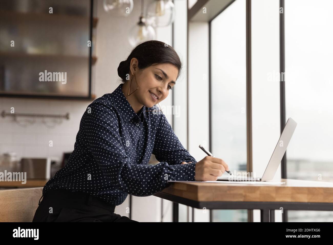 Smiling Indian woman study online on computer Stock Photo - Alamy