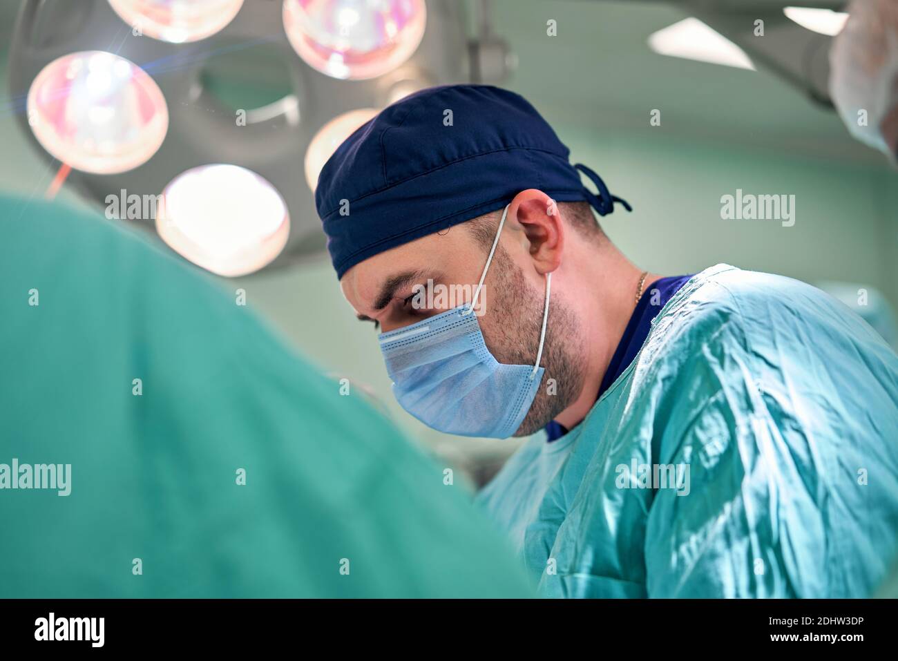 Operating room nurse looking down hi-res stock photography and images ...