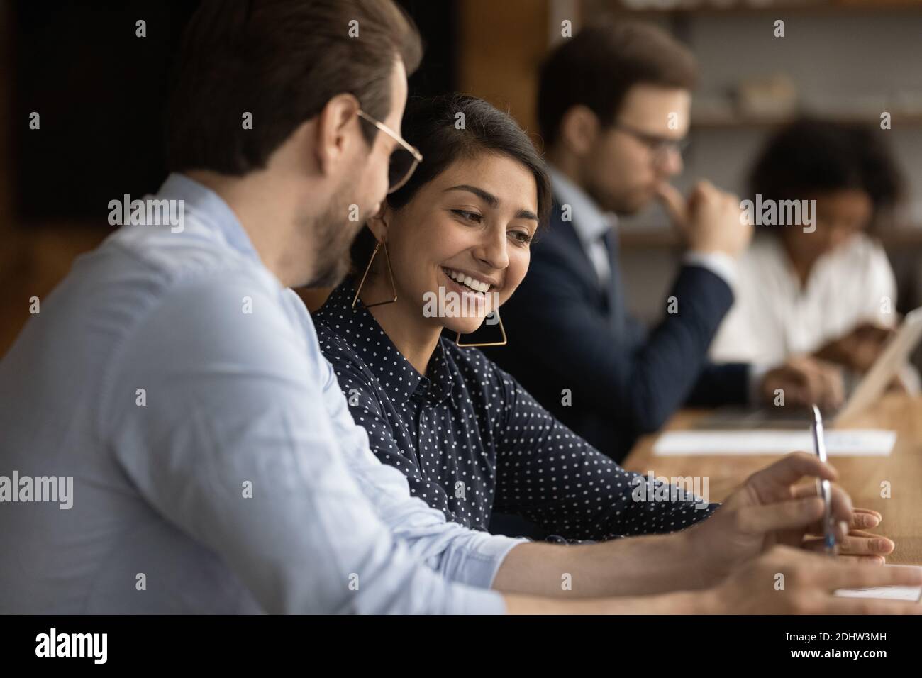 Smiling diverse colleagues work together at workplace Stock Photo - Alamy