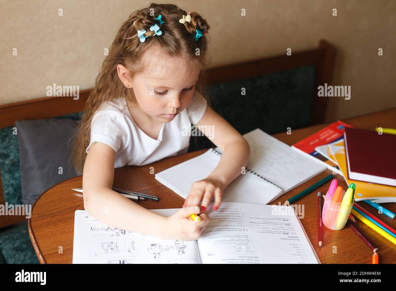pretty little girl doing homework at home. Home education Stock Photo ...