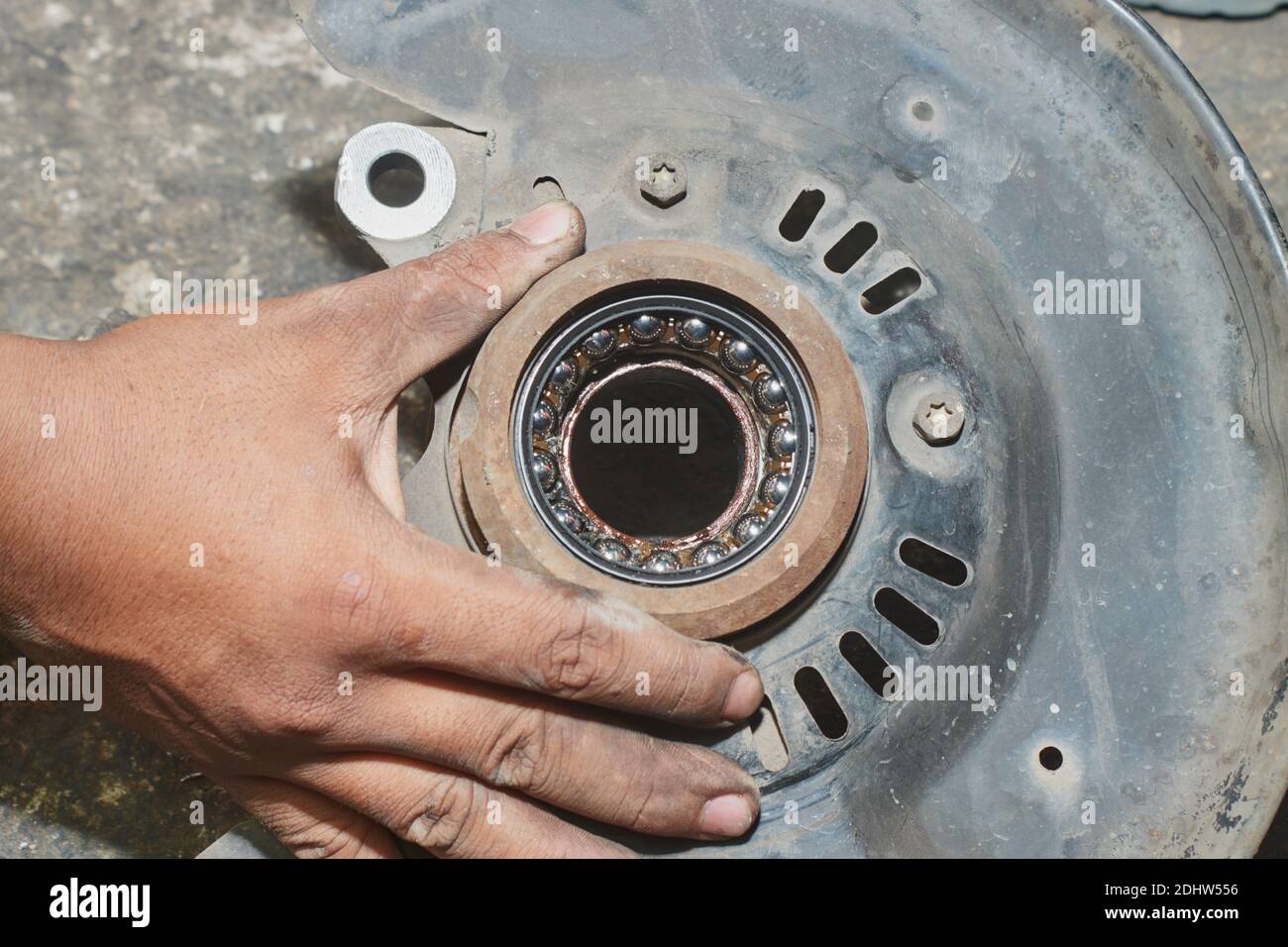 Hand of Car Mechanic or Auto Mechanic Hold Car Bearing Housing on Wheel ...