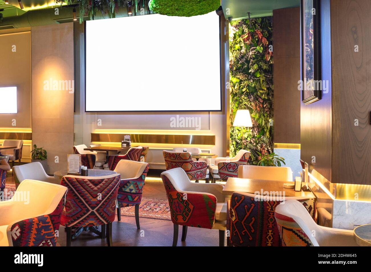 Cozy modern interior of restaurant, teahouse with white projector ...