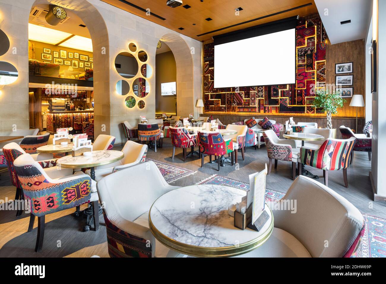 Cozy modern interior of restaurant, teahouse with white projector ...