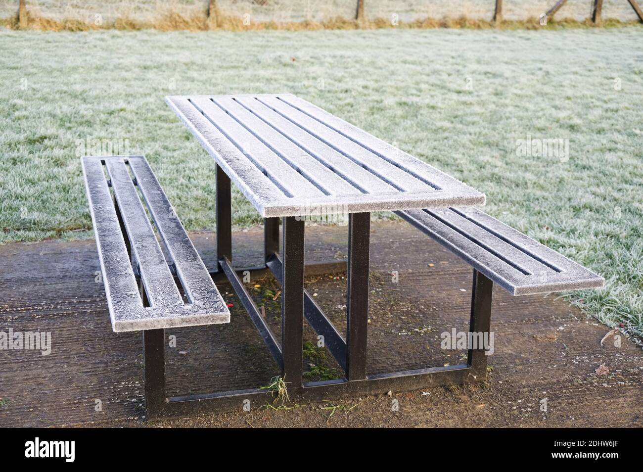 Frozen bench and seats in play park during winter Stock Photo - Alamy