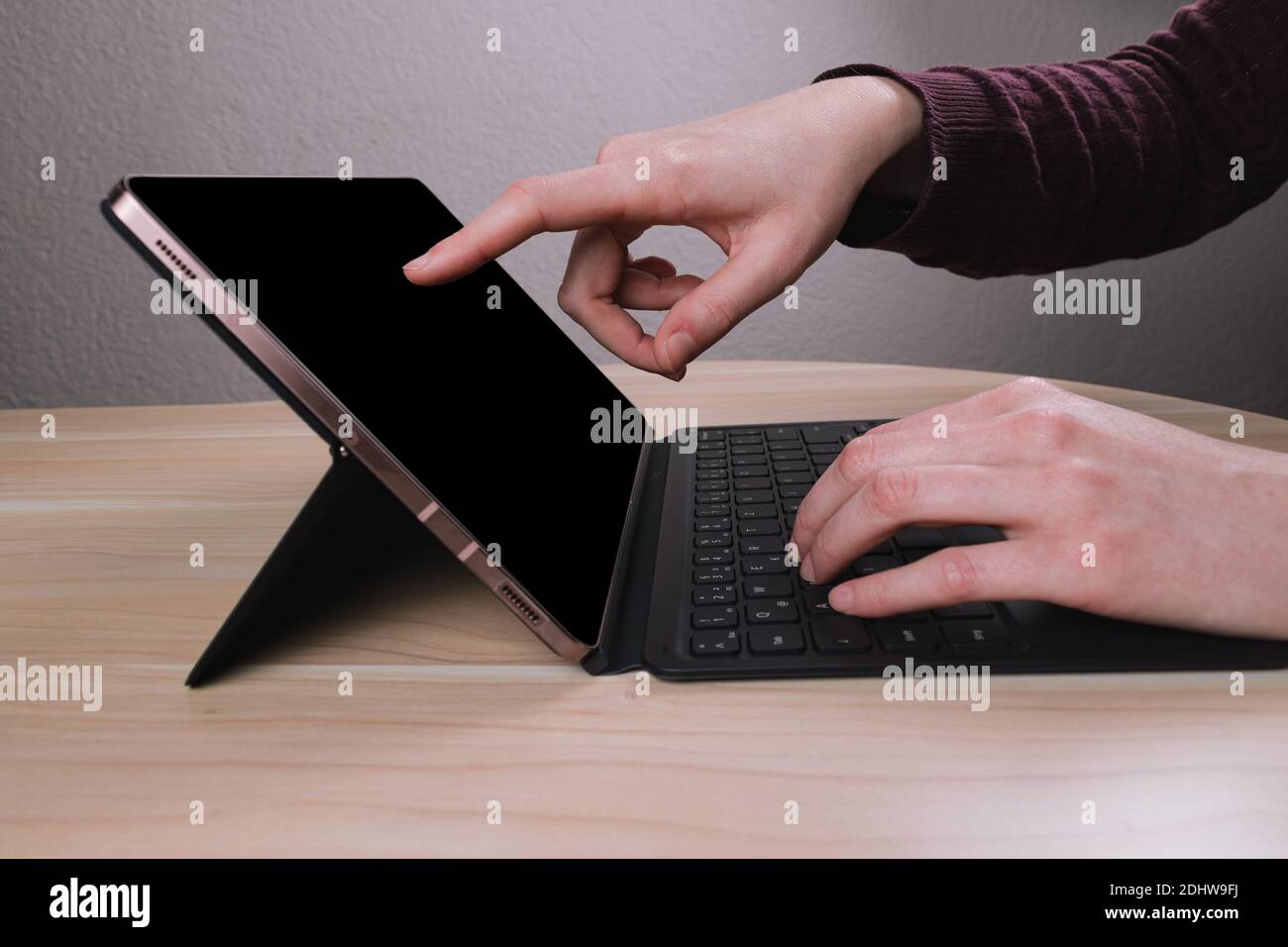 Business woman pointing on digital tablet screen with keyboard, blank ...