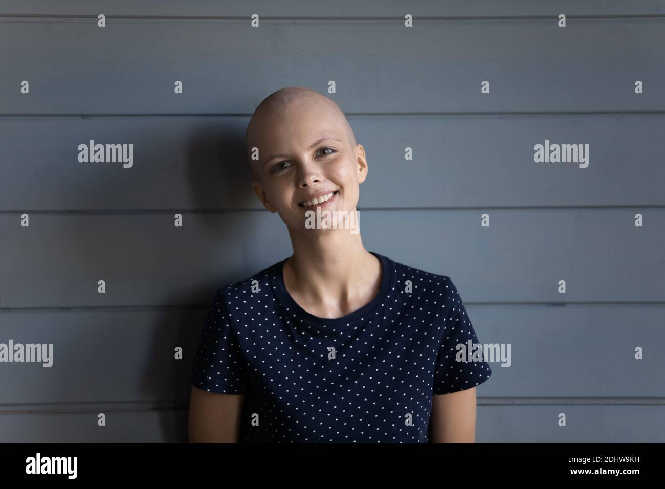 Head shot portrait smiling hairless woman on grey background Stock ...