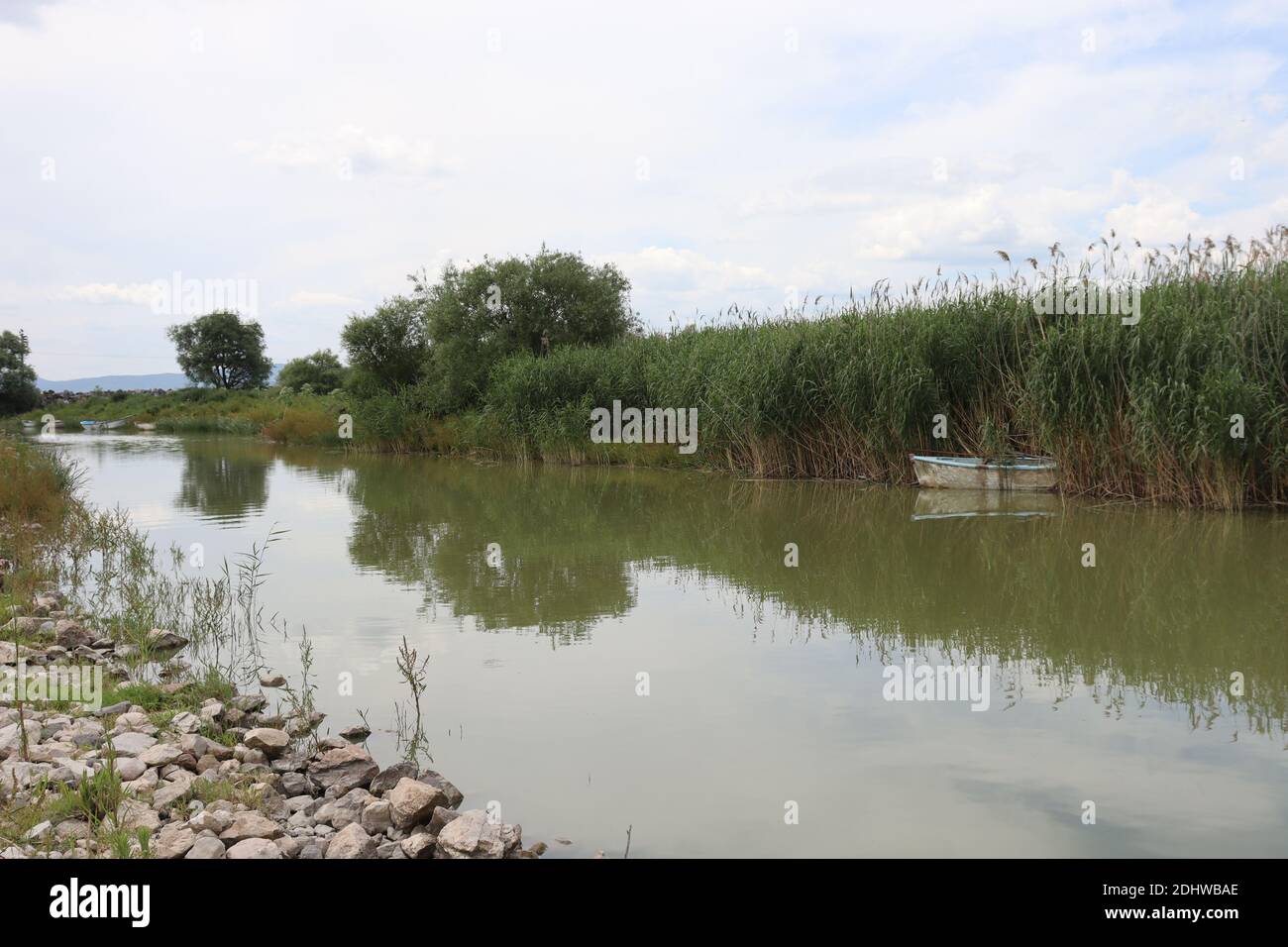 a river with old boats Stock Photo - Alamy