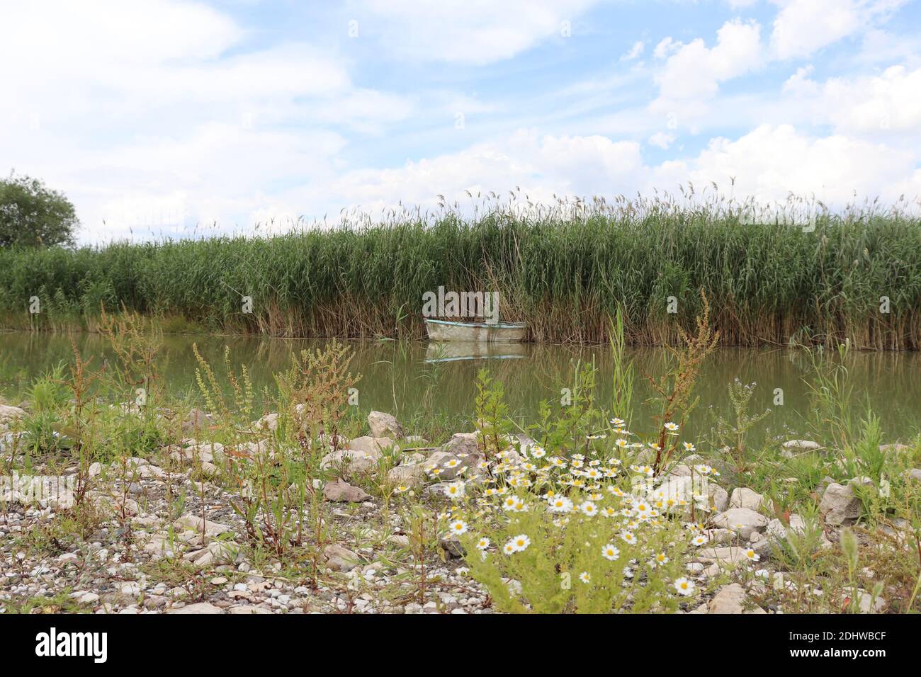 a river with old boats Stock Photo - Alamy