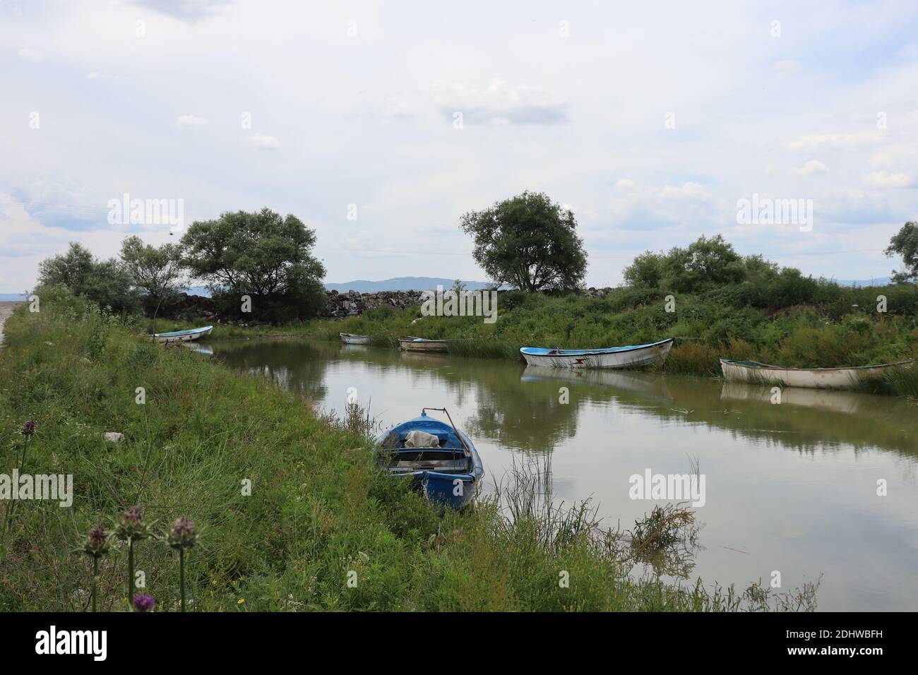a river with old boats Stock Photo - Alamy