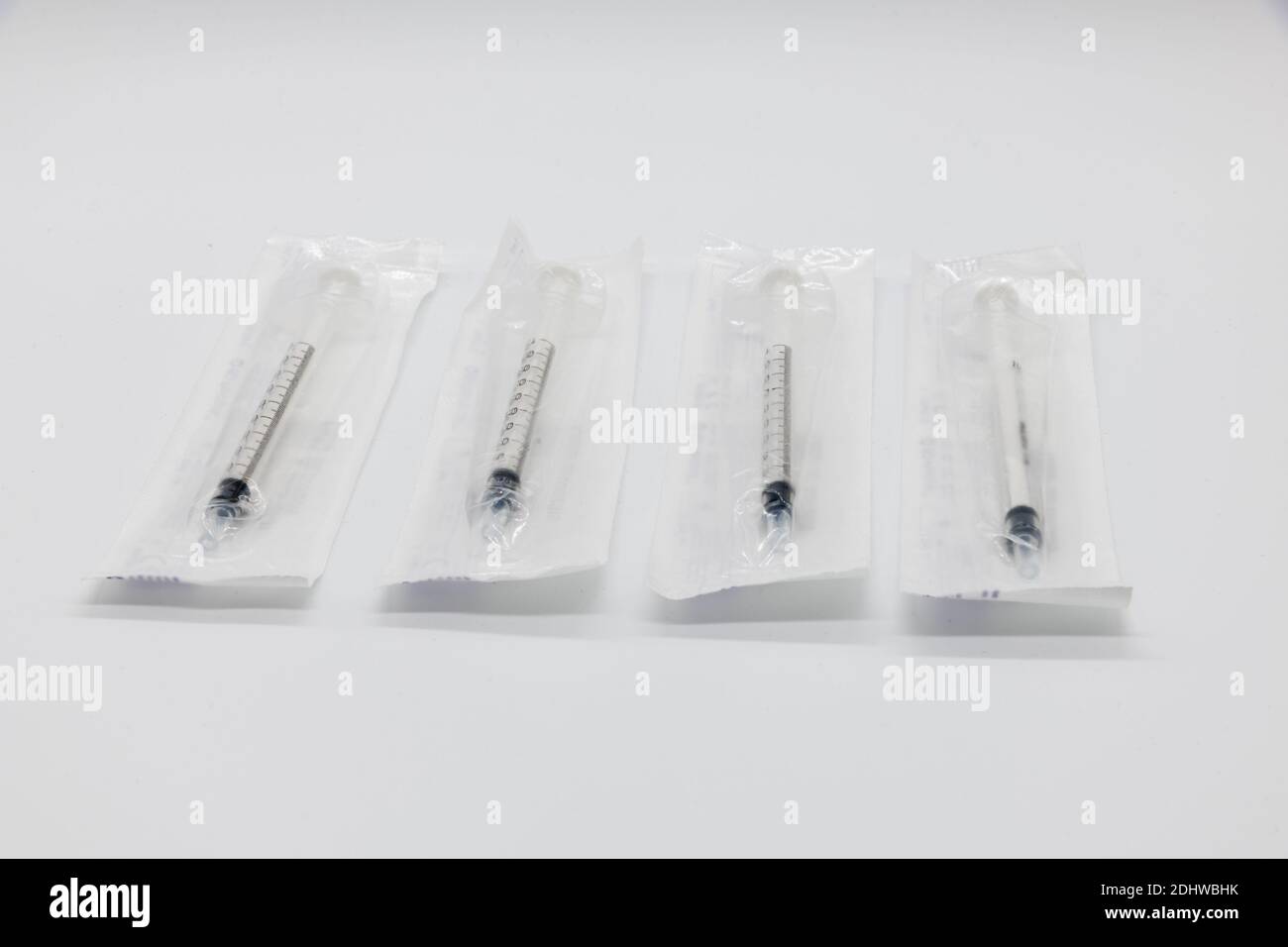 Syringes four syringes in packets hi-res stock photography and images ...