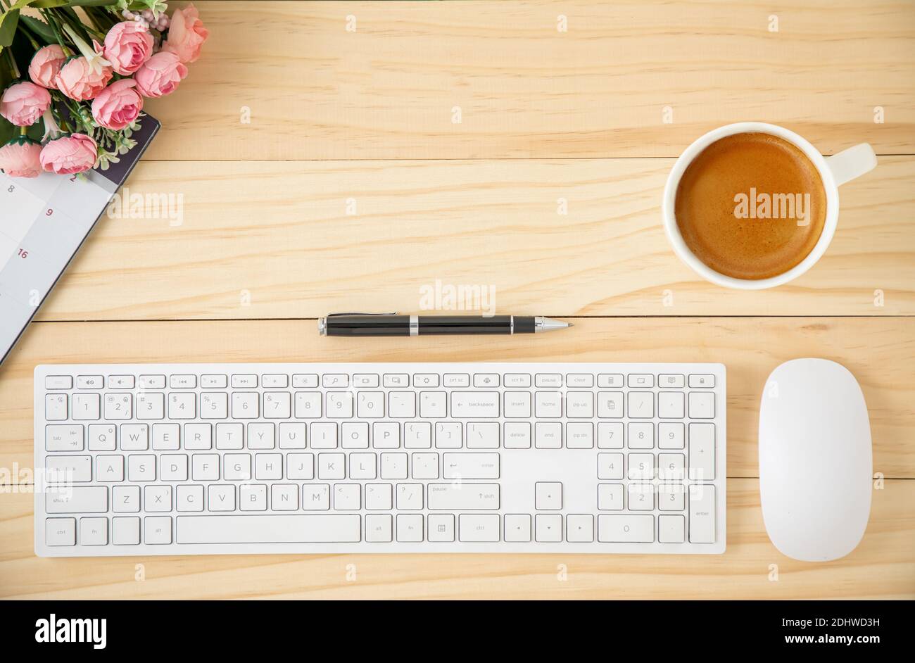 A Minimal Business Workspace With White Wireless Computer Mouse And