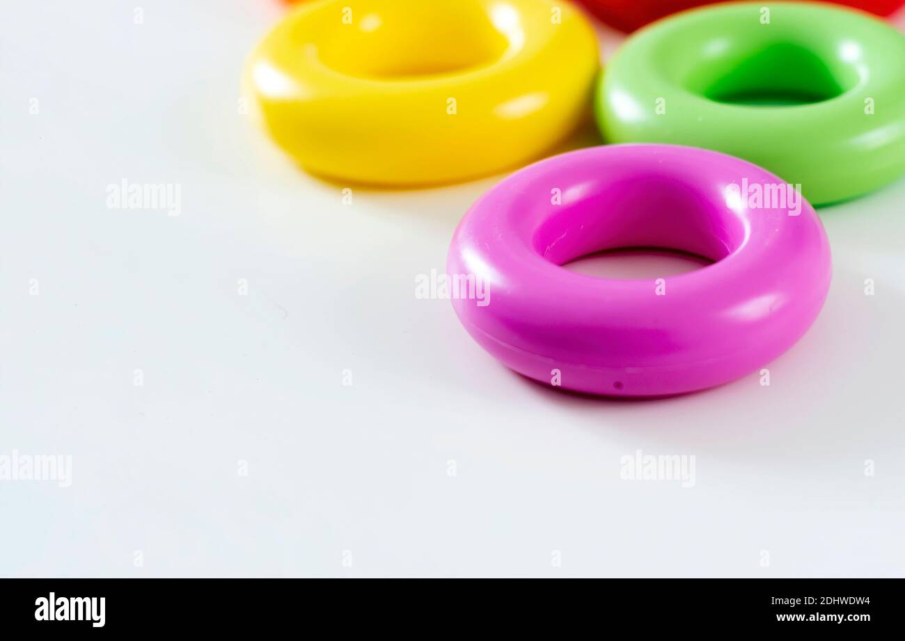 colorful plastic rings isolated on a white background. Children's toys ...