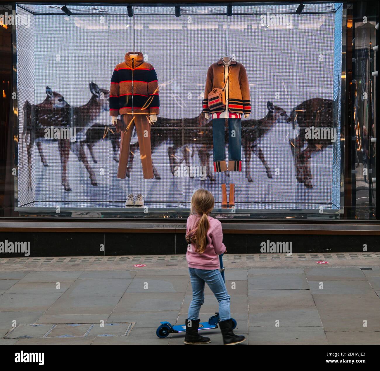 Little girl window shopping in hi-res stock photography and images - Alamy