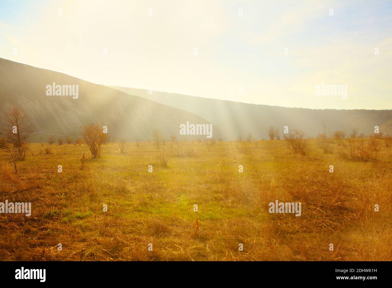 Sun over the hills in the autumn . Autumnal scenery with sunlight ...