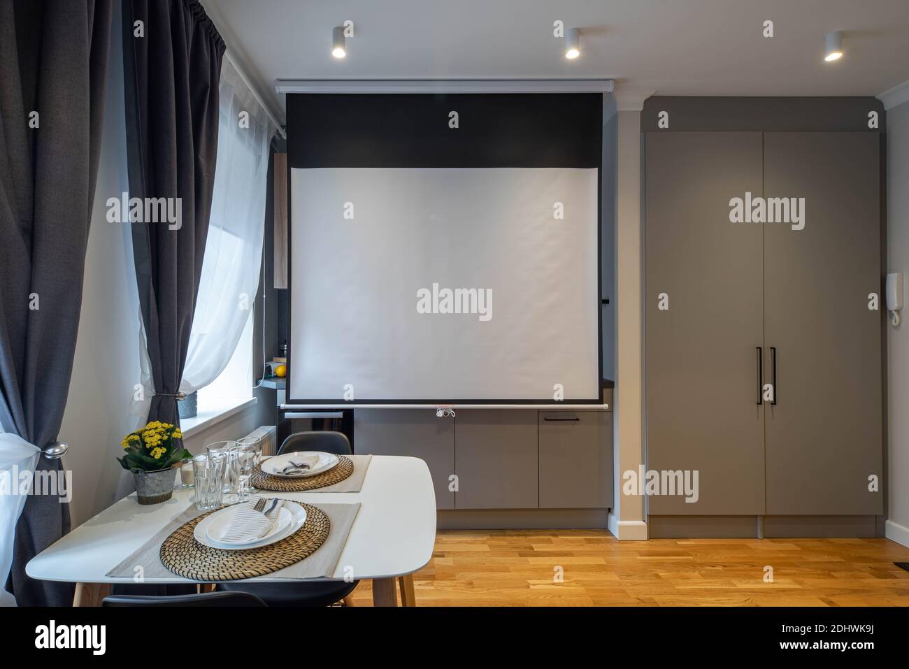 Modern interior of kitchen in luxury apartment. Wooden table and chairs ...